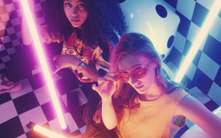 Urban girls between bars of colored light – Kaisoft